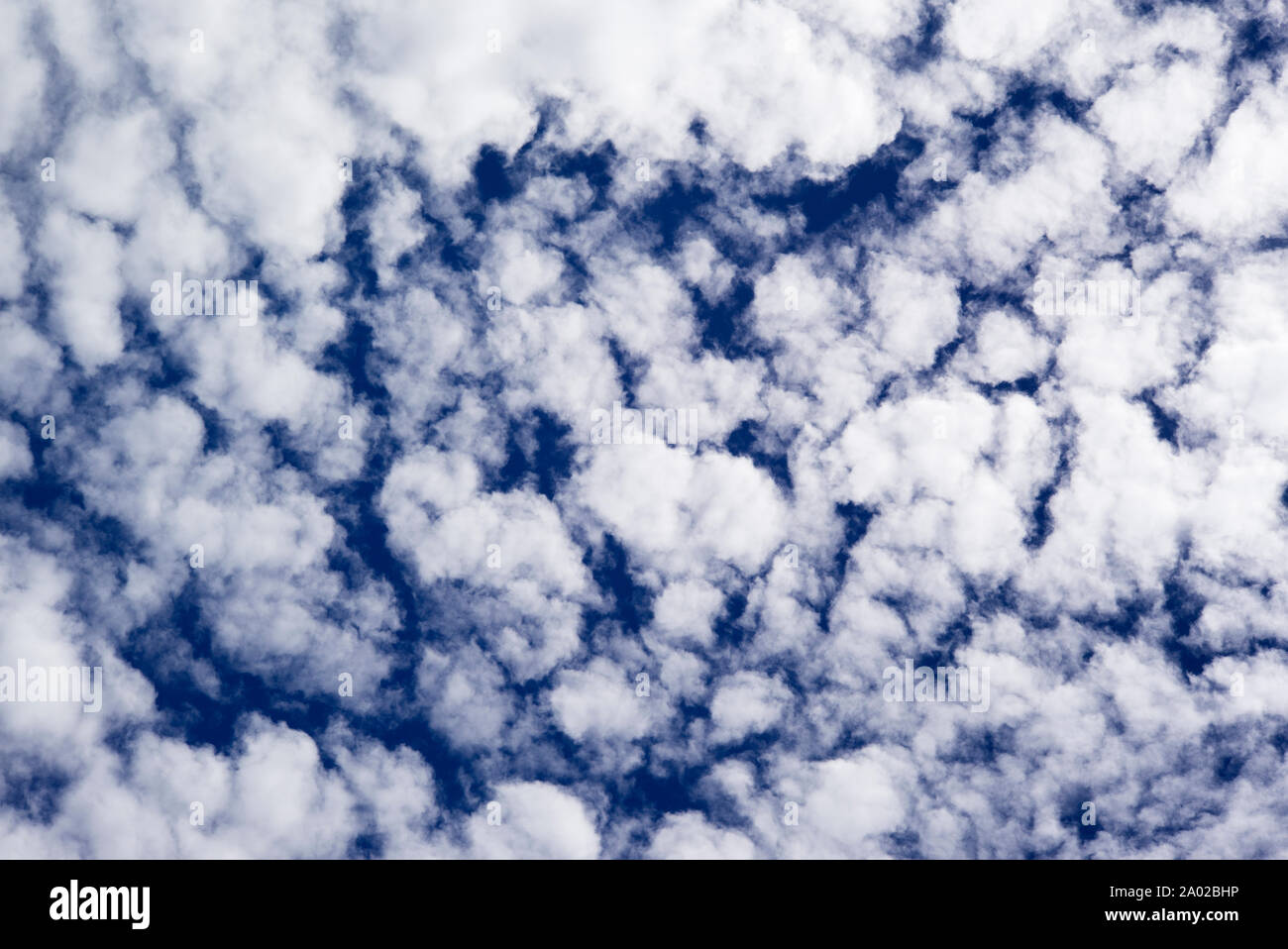 Small clouds in blue sky Stock Photo - Alamy