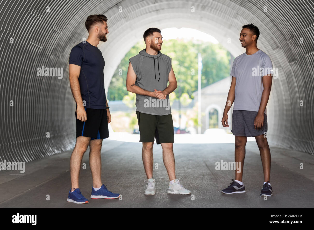 Male friends talking hi-res stock photography and images - Alamy