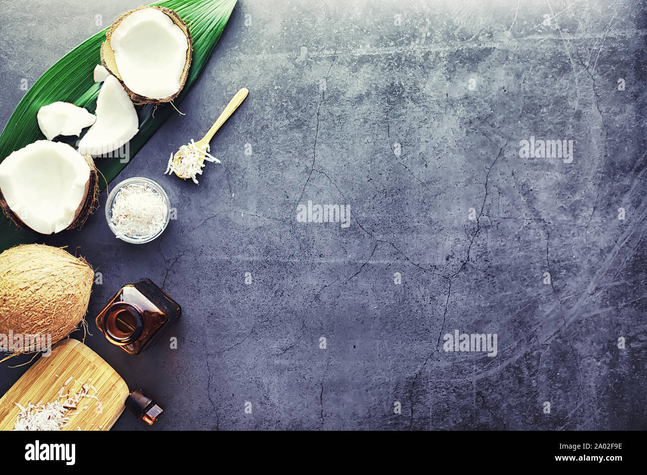 Coconut on a dark stone table. Coconut oil Stock Photo - Alamy