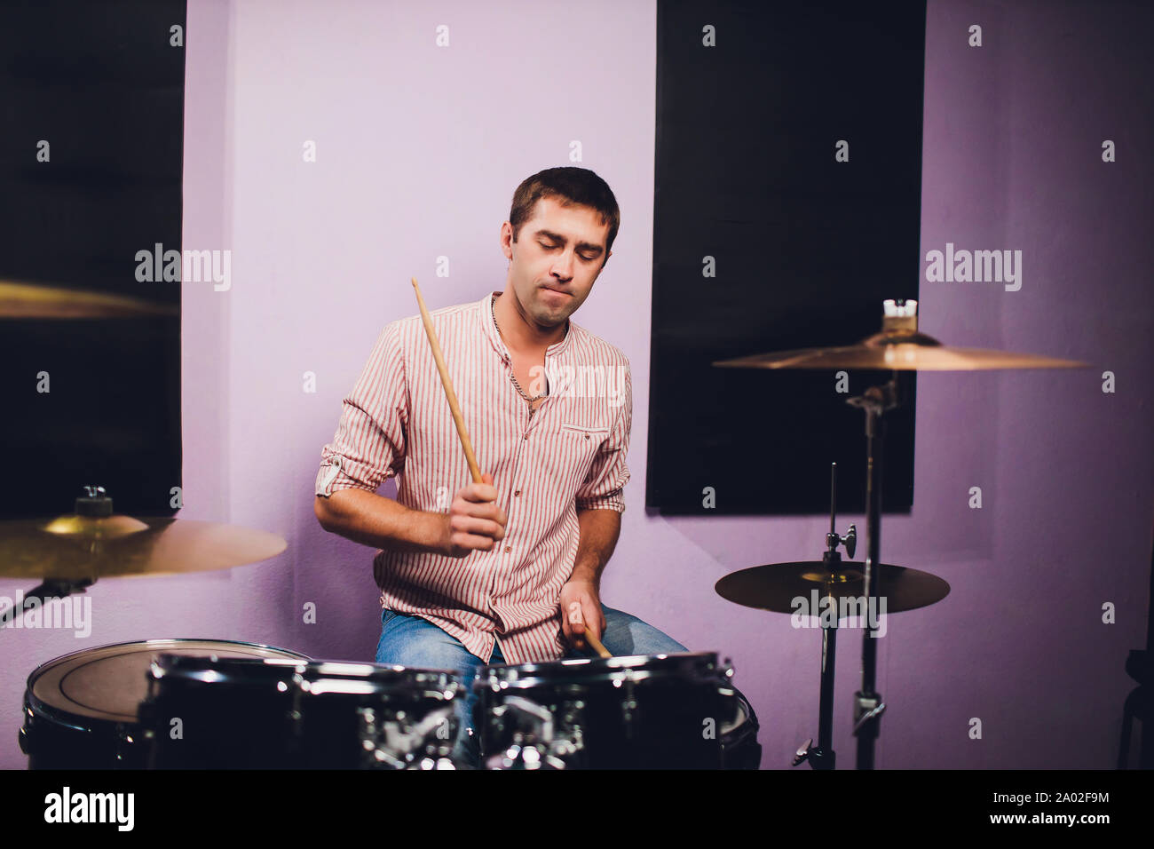 Young drummer behind drum hi-res stock photography and images - Alamy