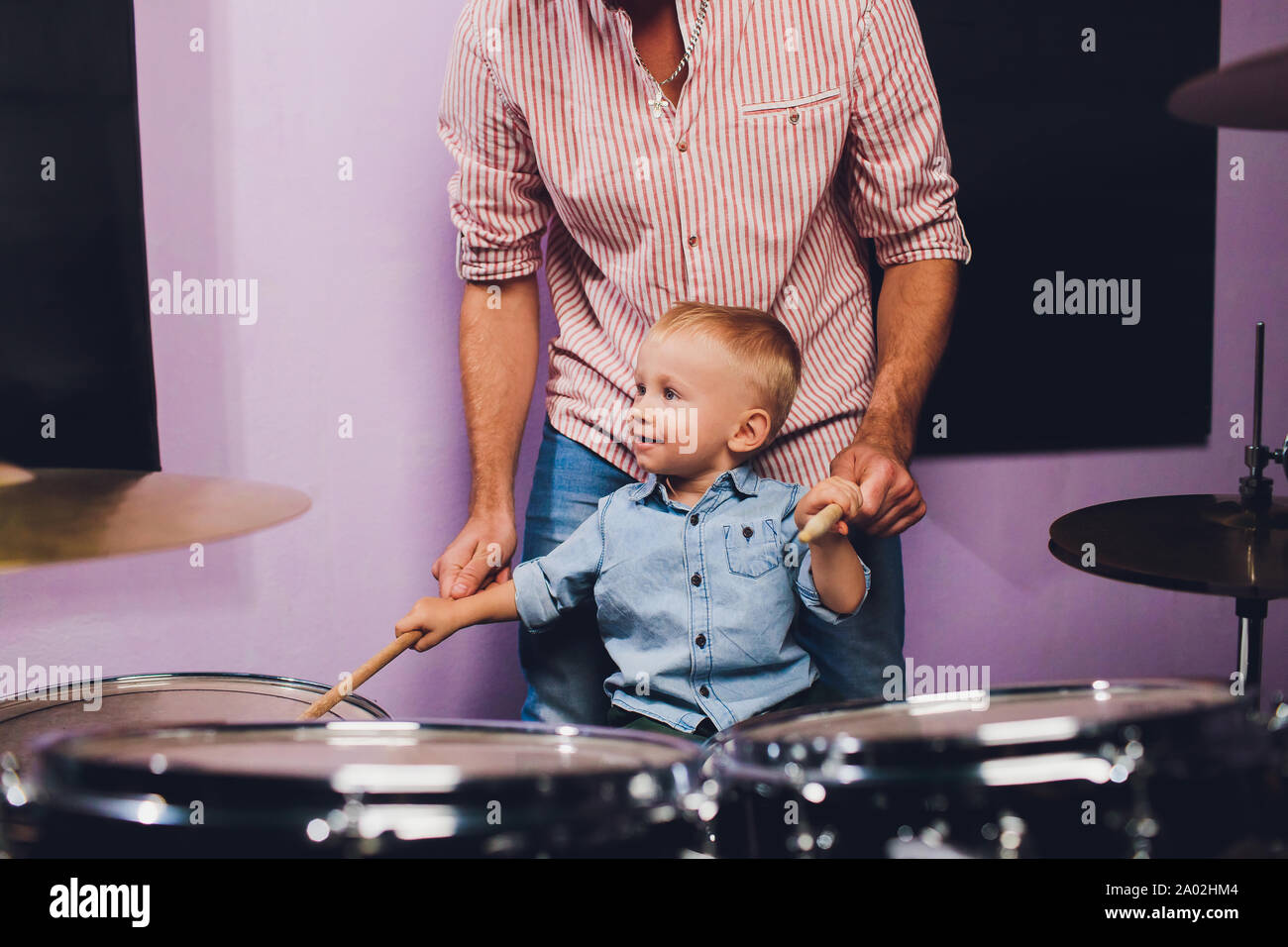 little boy plays drums in recording studio Stock Photo - Alamy