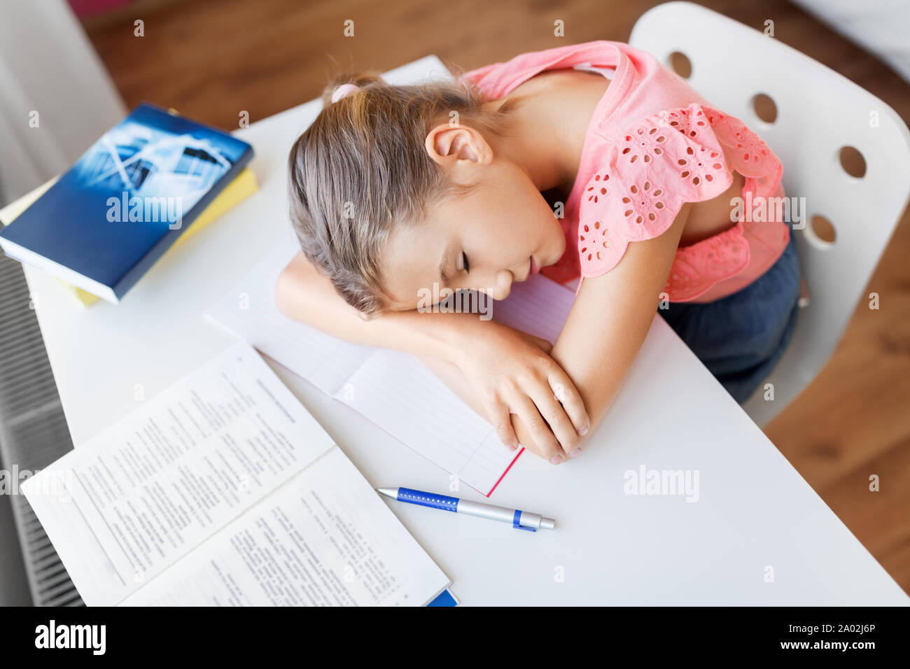 tired student girl sleeping on table at home Stock Photo - Alamy