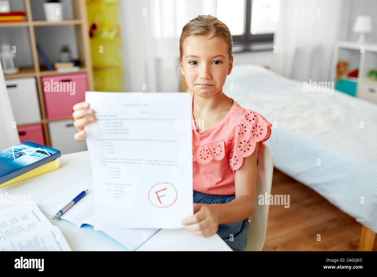 sad student girl with failed school test at home Stock Photo - Alamy