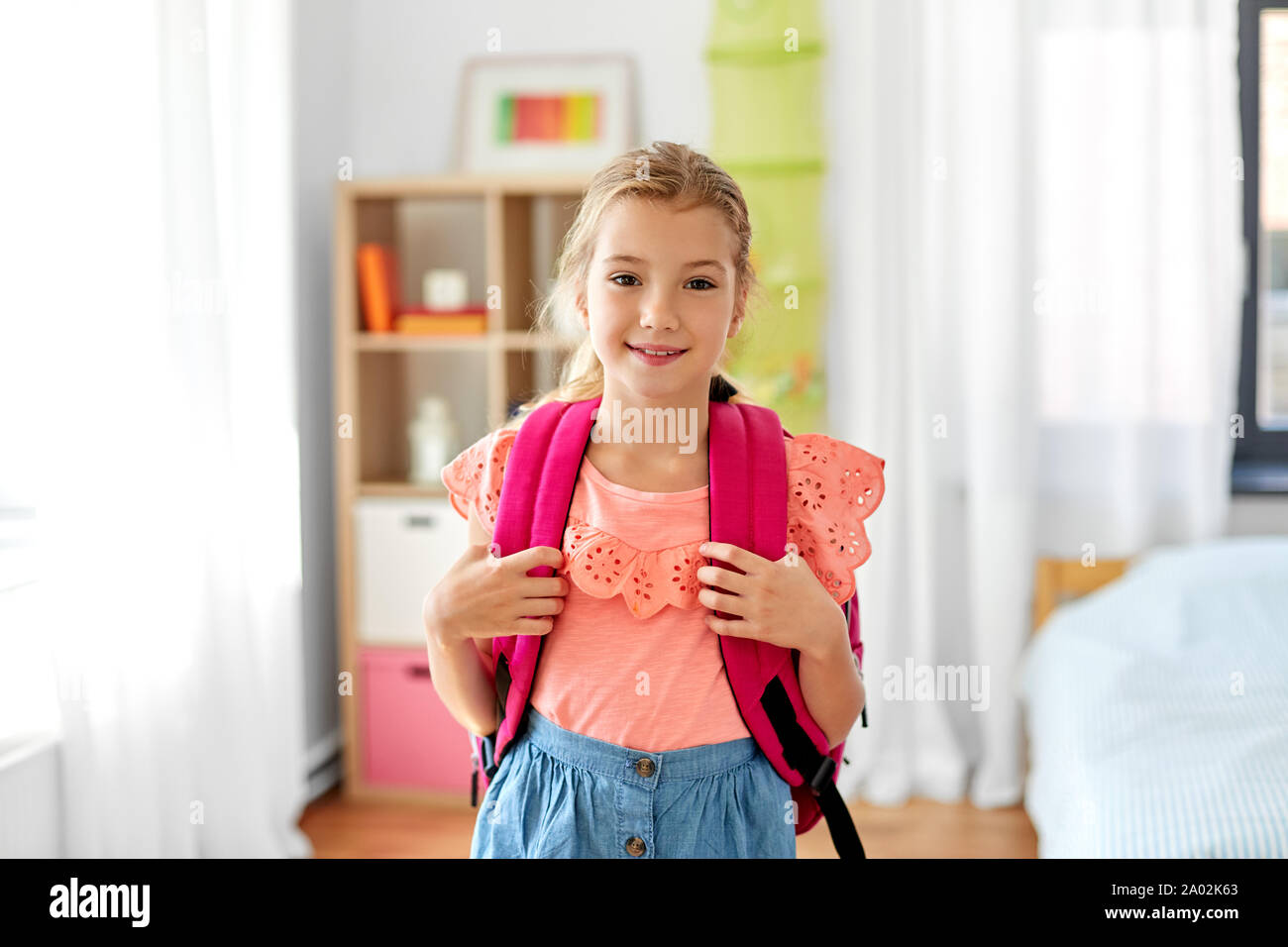 student girl with school bag at home Stock Photo - Alamy