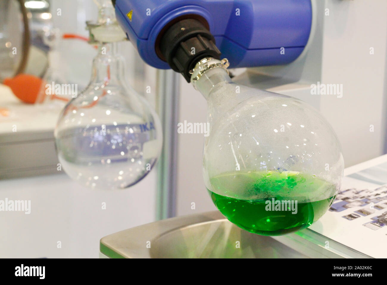 Chemical laboratory. Flasks and dishes with solutions ready for ...