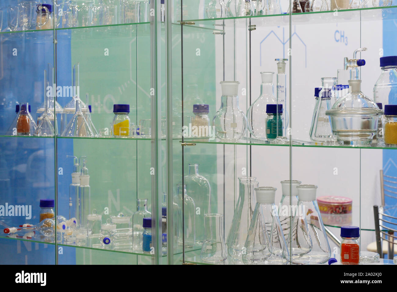 Chemical laboratory. Flasks and dishes with solutions ready for ...