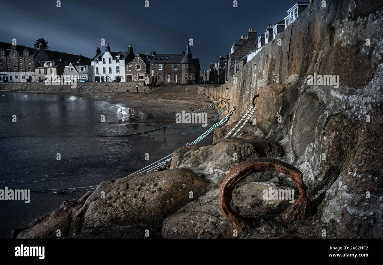 Stonehaven Harbour in Scotland, UK on a sunny winter morning with dark ...
