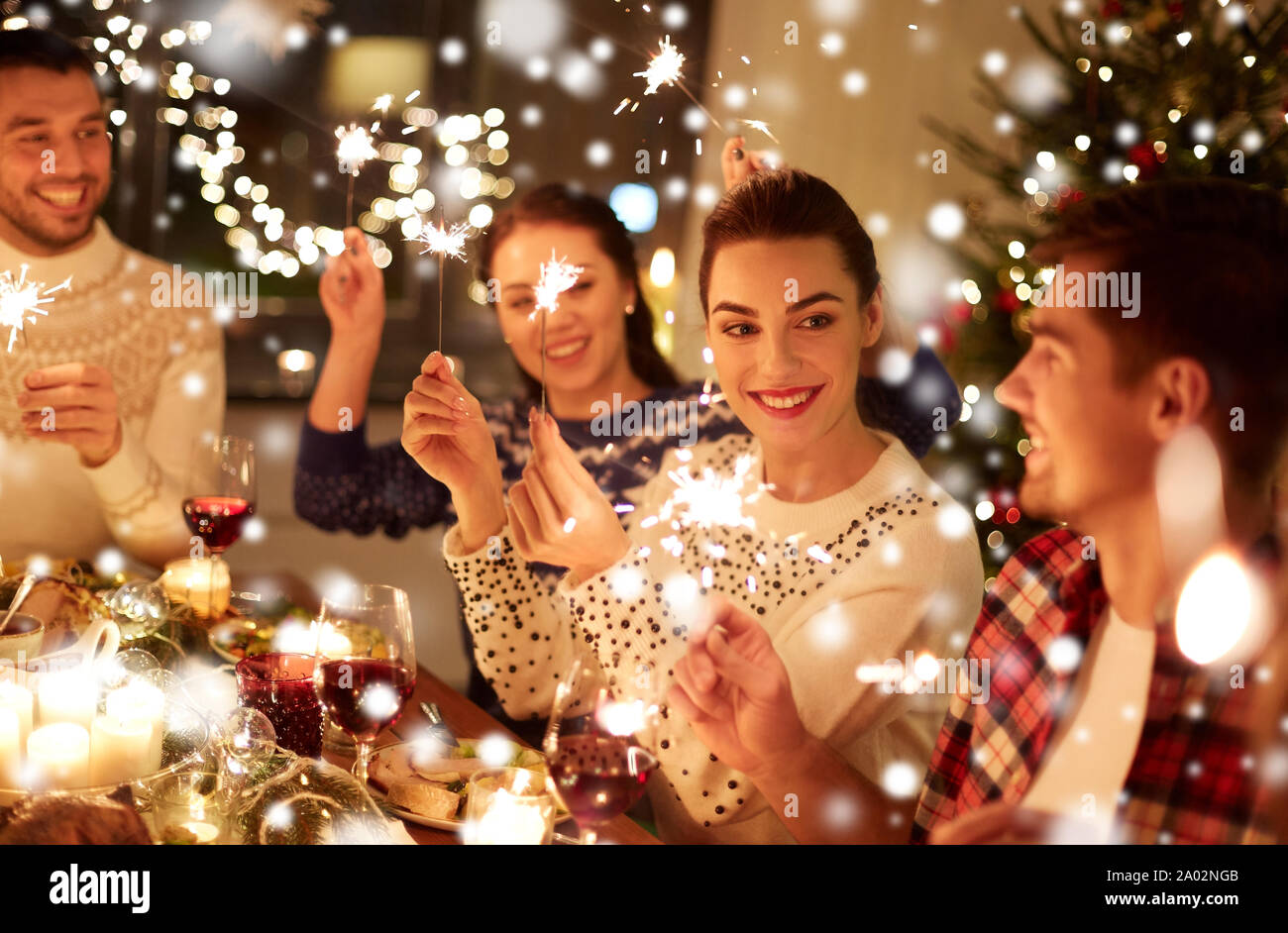 Friends celebrating christmas party happy hi-res stock photography and ...
