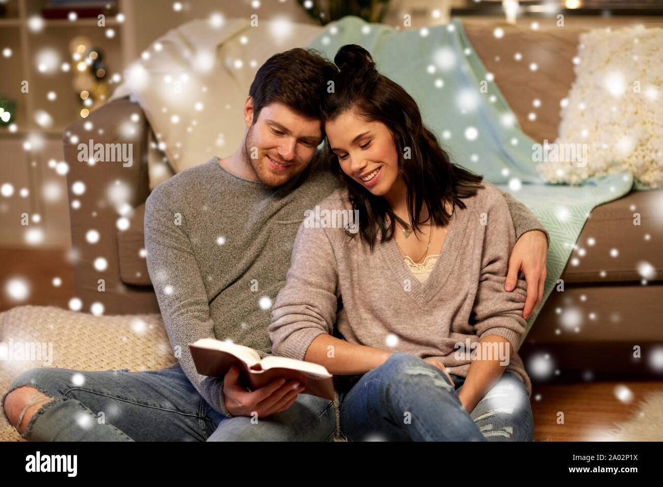 Beautiful romantic couple home reading hi-res stock photography and ...