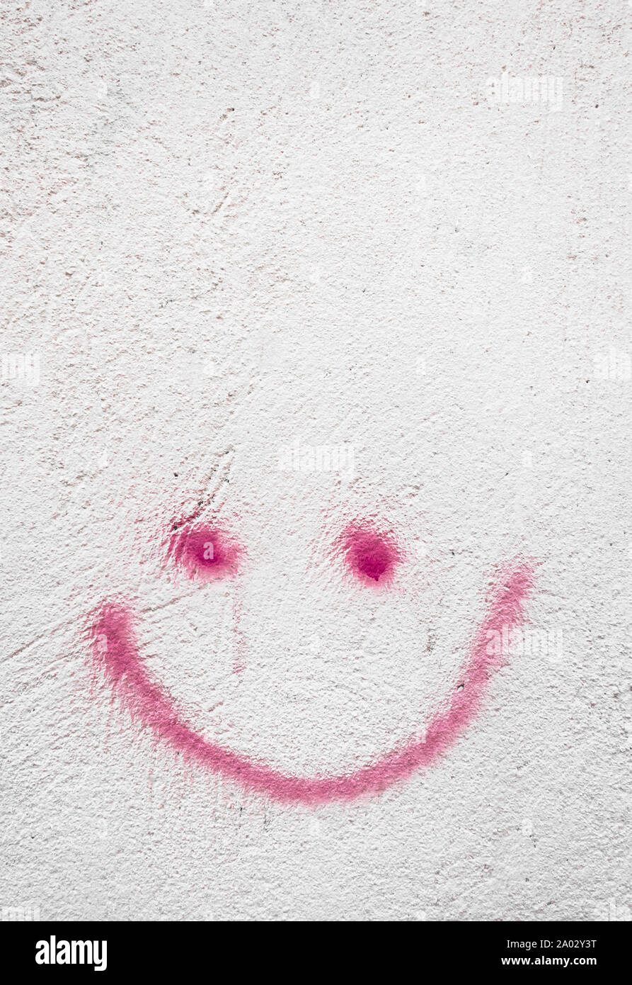 Concrete wall with red smiley, background for many uses Stock Photo - Alamy