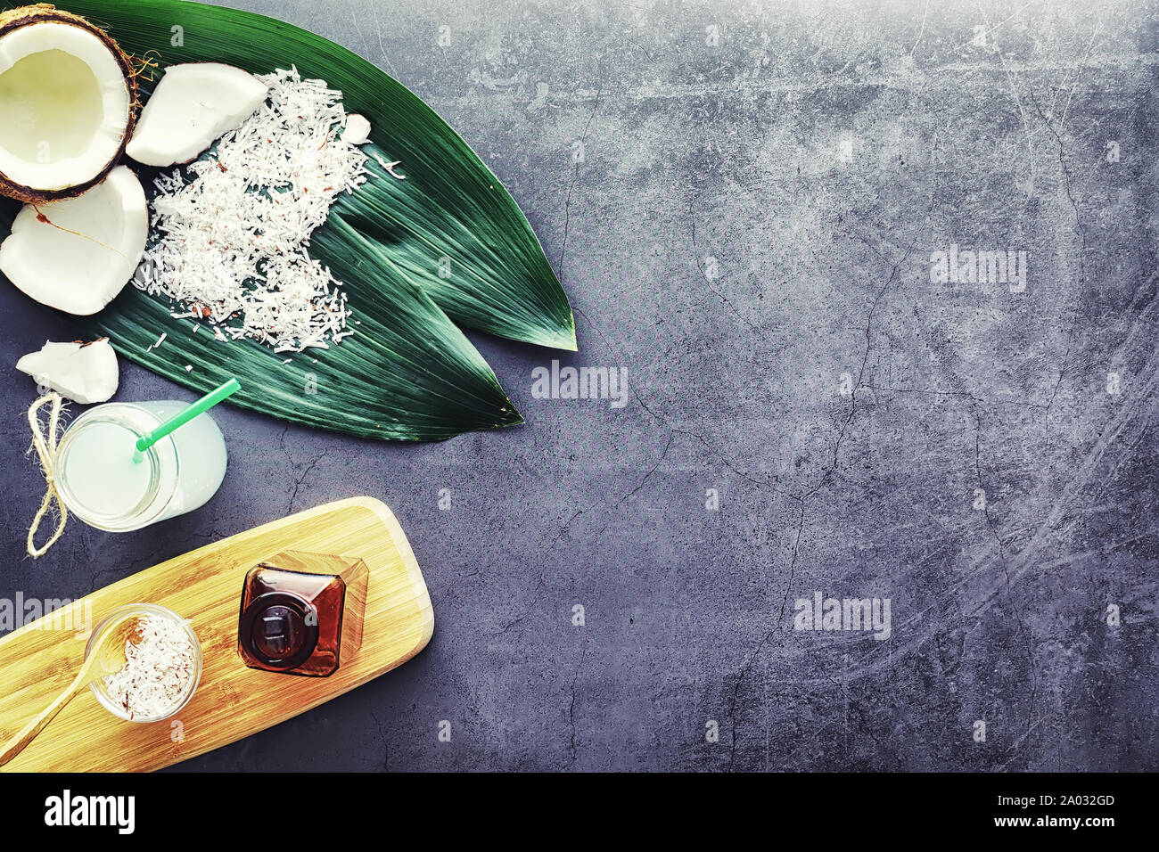 Coconut on a dark stone table. Coconut oil Stock Photo - Alamy