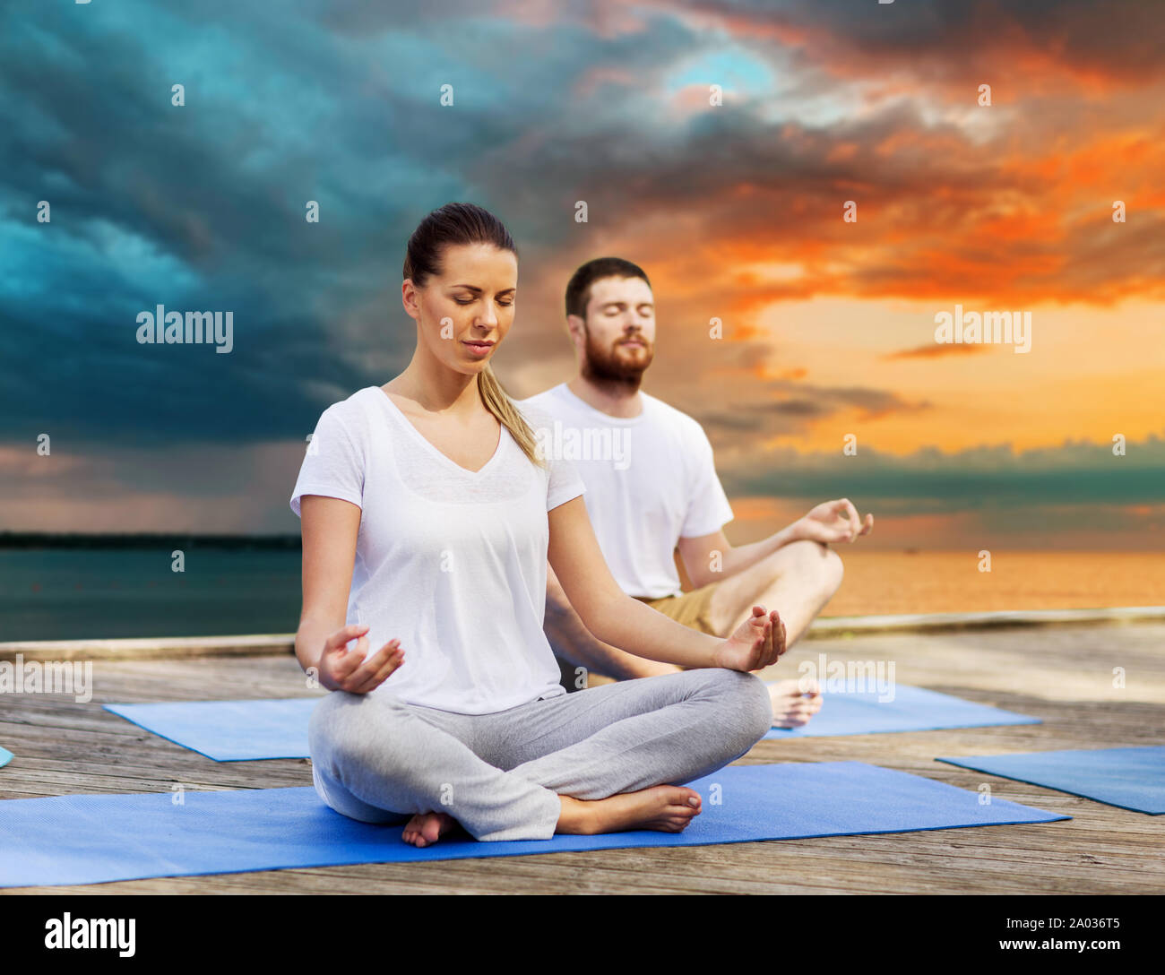 Couple in lotus position hi-res stock photography and images - Alamy