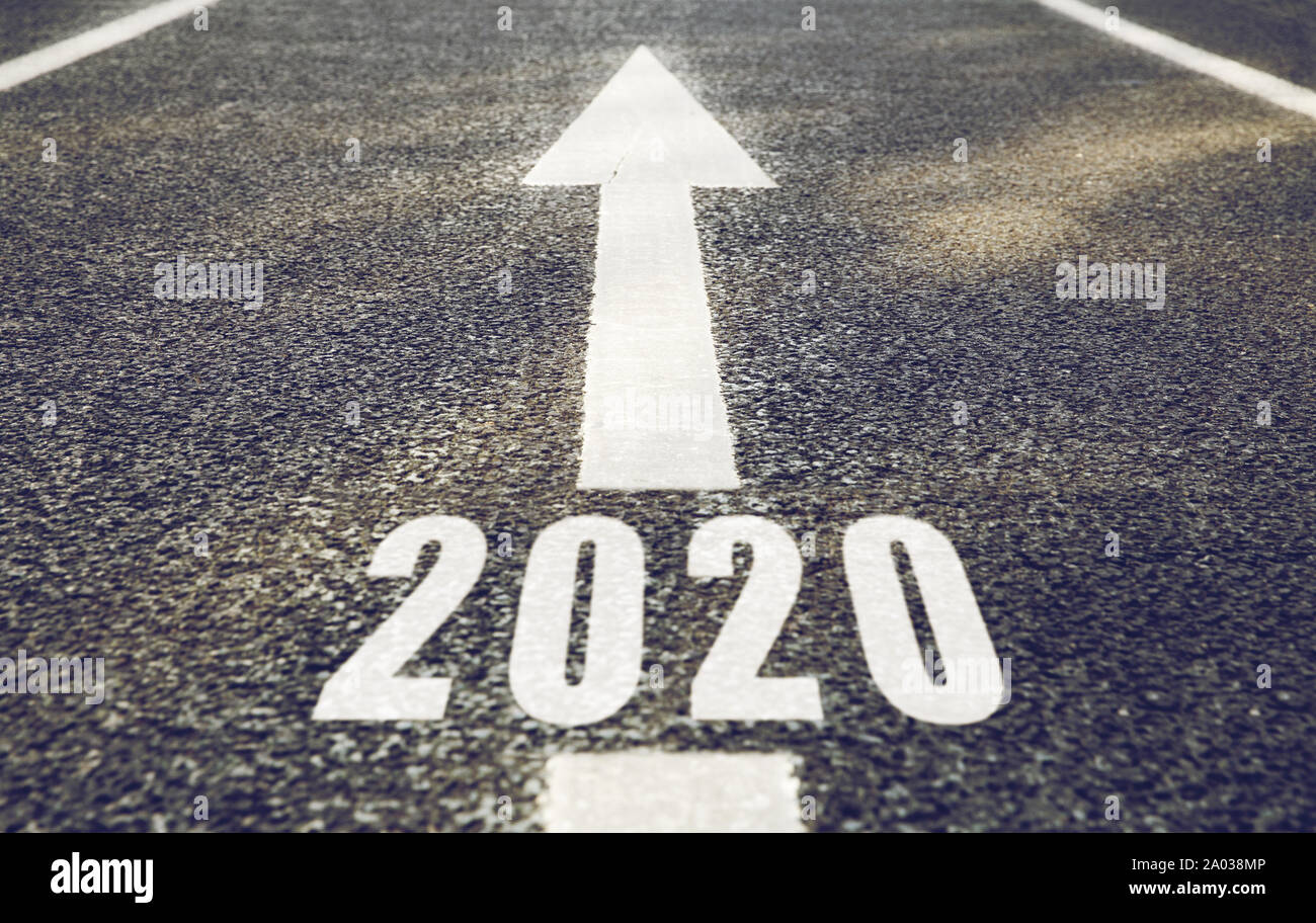 white road marking in form of 2020 year and arrow Stock Photo - Alamy
