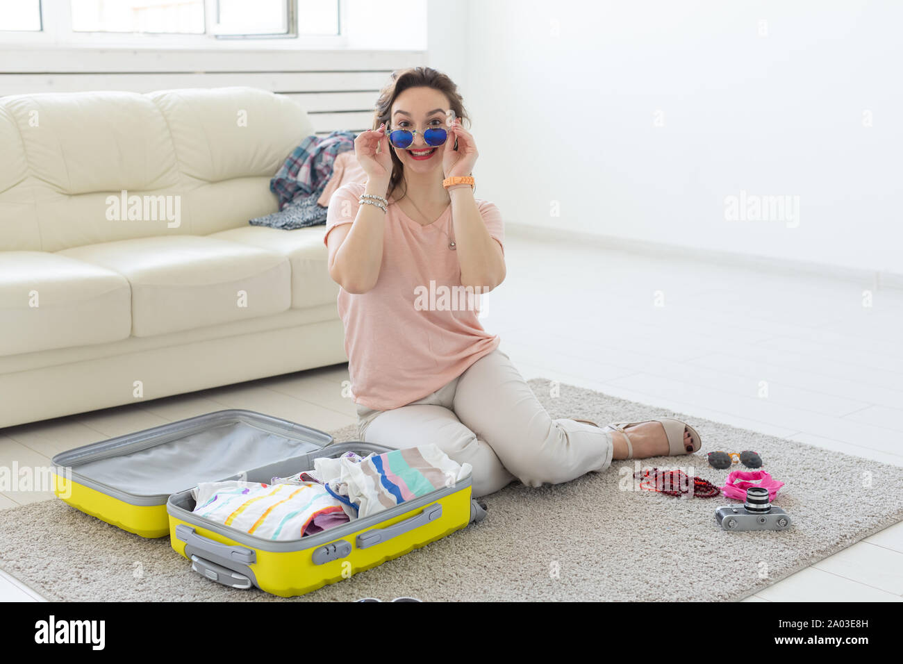 Female sitting collecting clothes hi-res stock photography and images ...