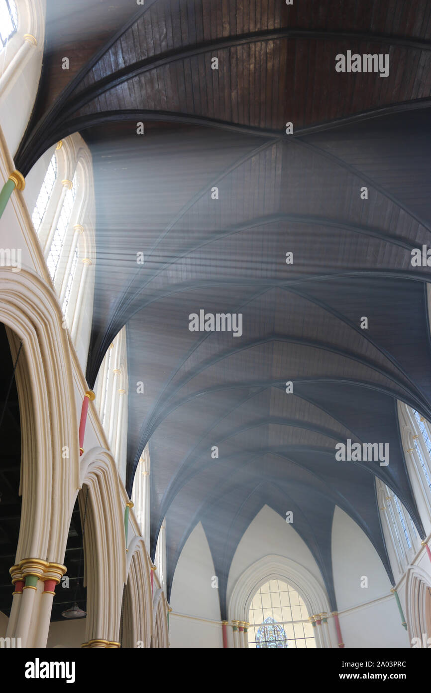 Sunlight streaming through the windows of a church highlighted by the ...