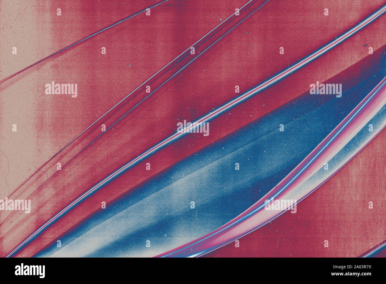 A real wisp of white and blue smoke on a red background with grain ...