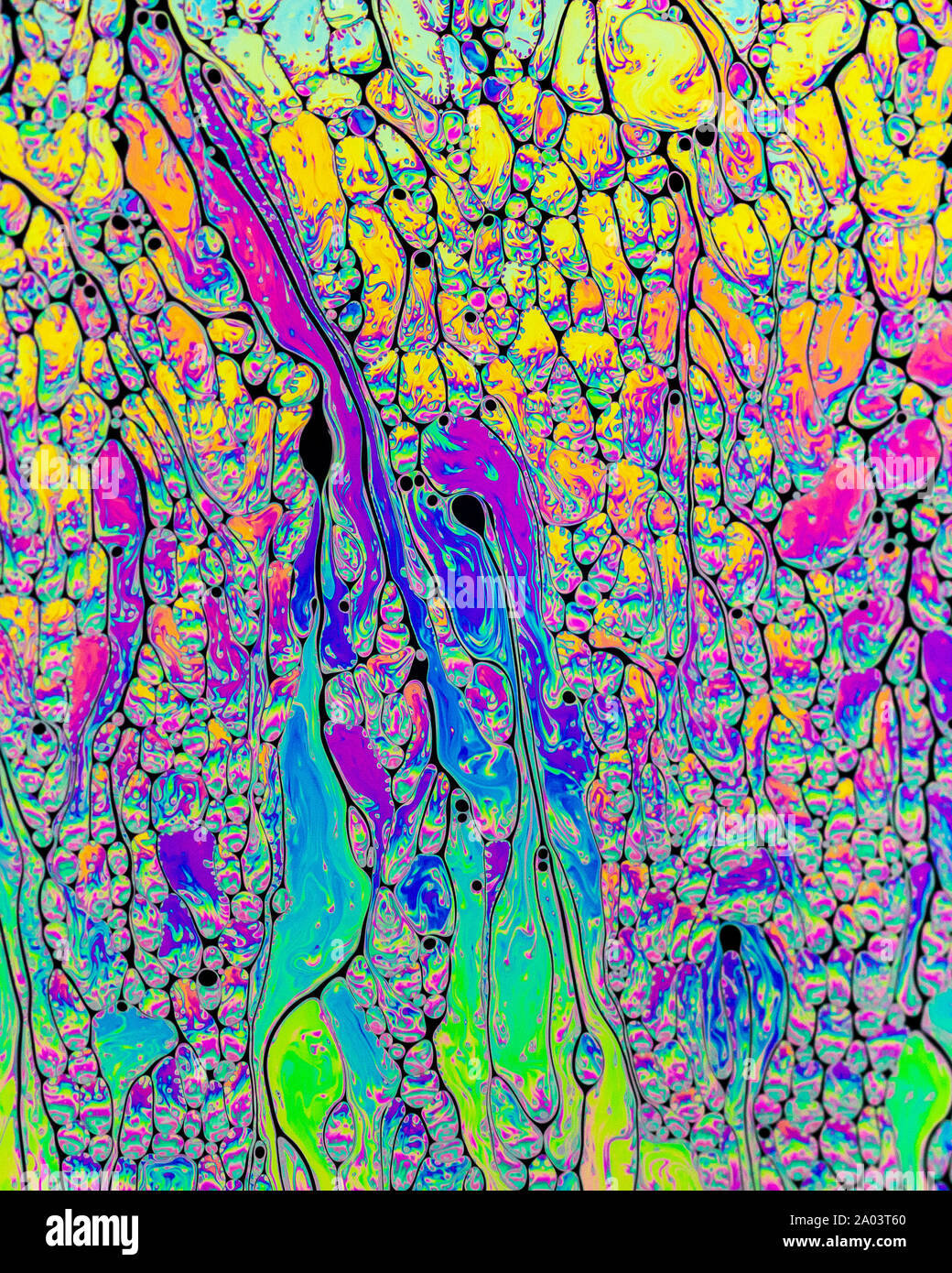 A creative abstract swirling liquid rainbow of colours that looks like ...