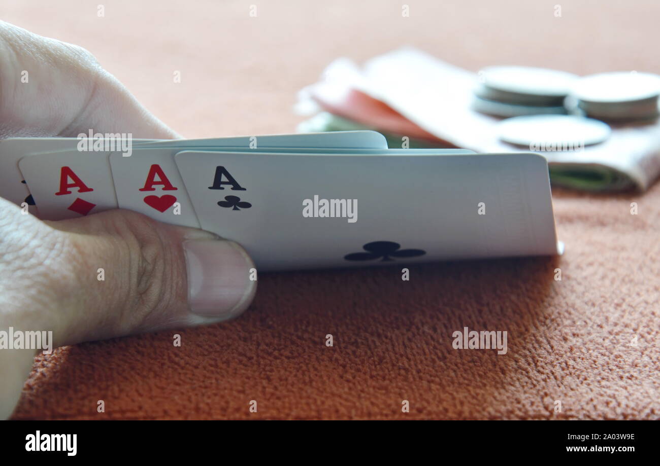 hand opened play card on table Stock Photo - Alamy