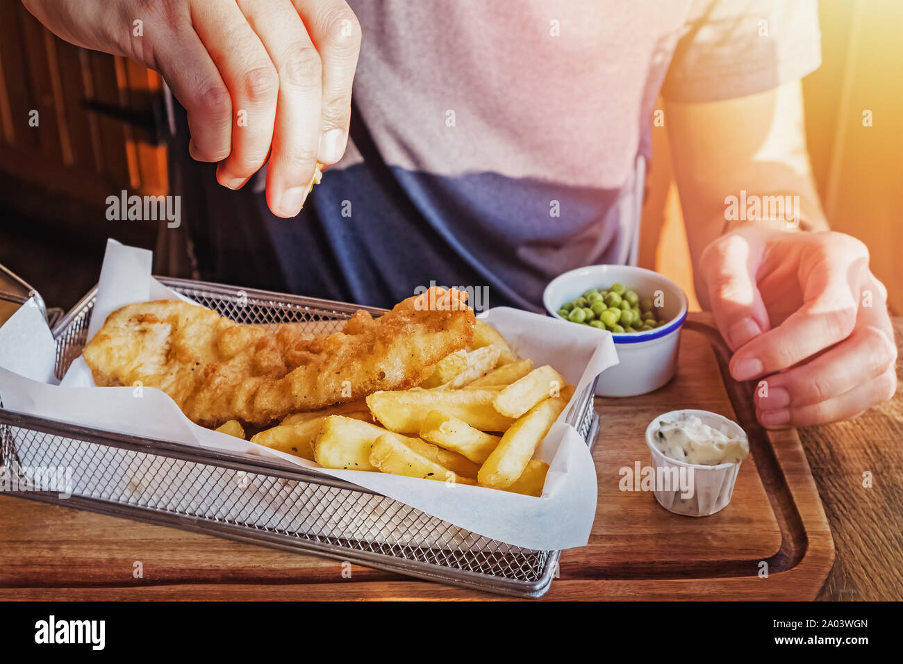 Battered fish hand hi-res stock photography and images - Alamy