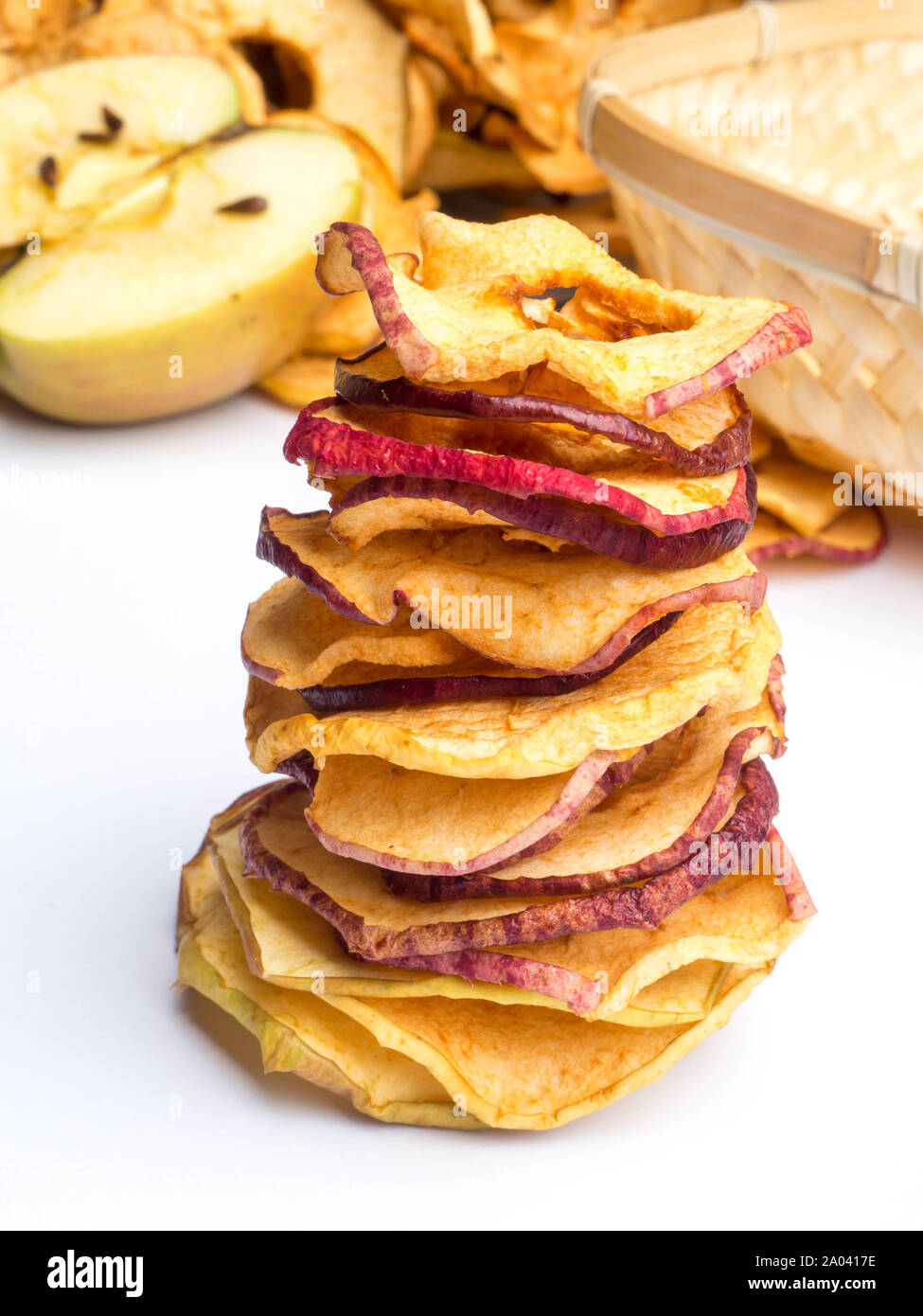 vegetarian dries apples tower, dehydrated healthy snack chips on white ...