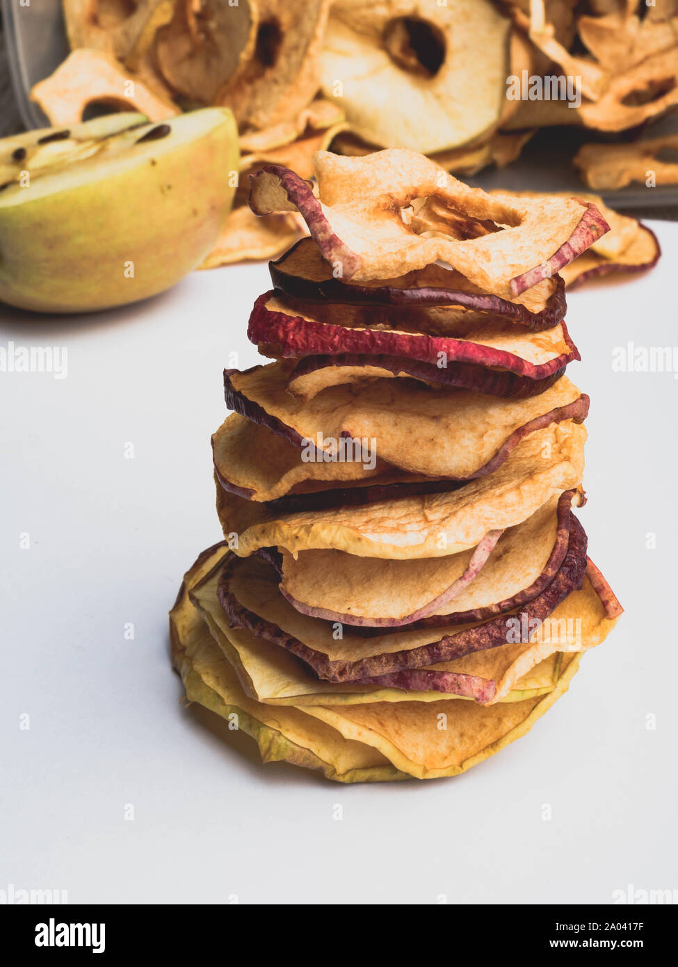 vegetarian dries apples tower, dehydrated healthy snack chips on white ...