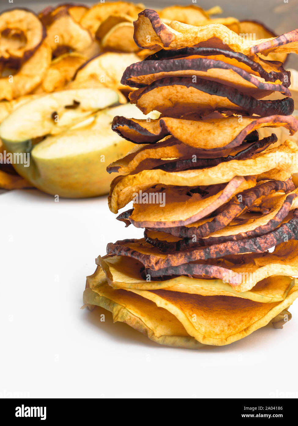 vegetarian dries apples tower, dehydrated healthy snack chips on white ...