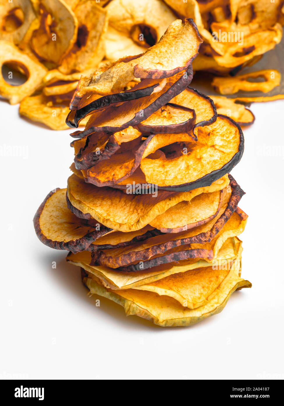 vegetarian dries apples tower, dehydrated healthy snack chips on white ...