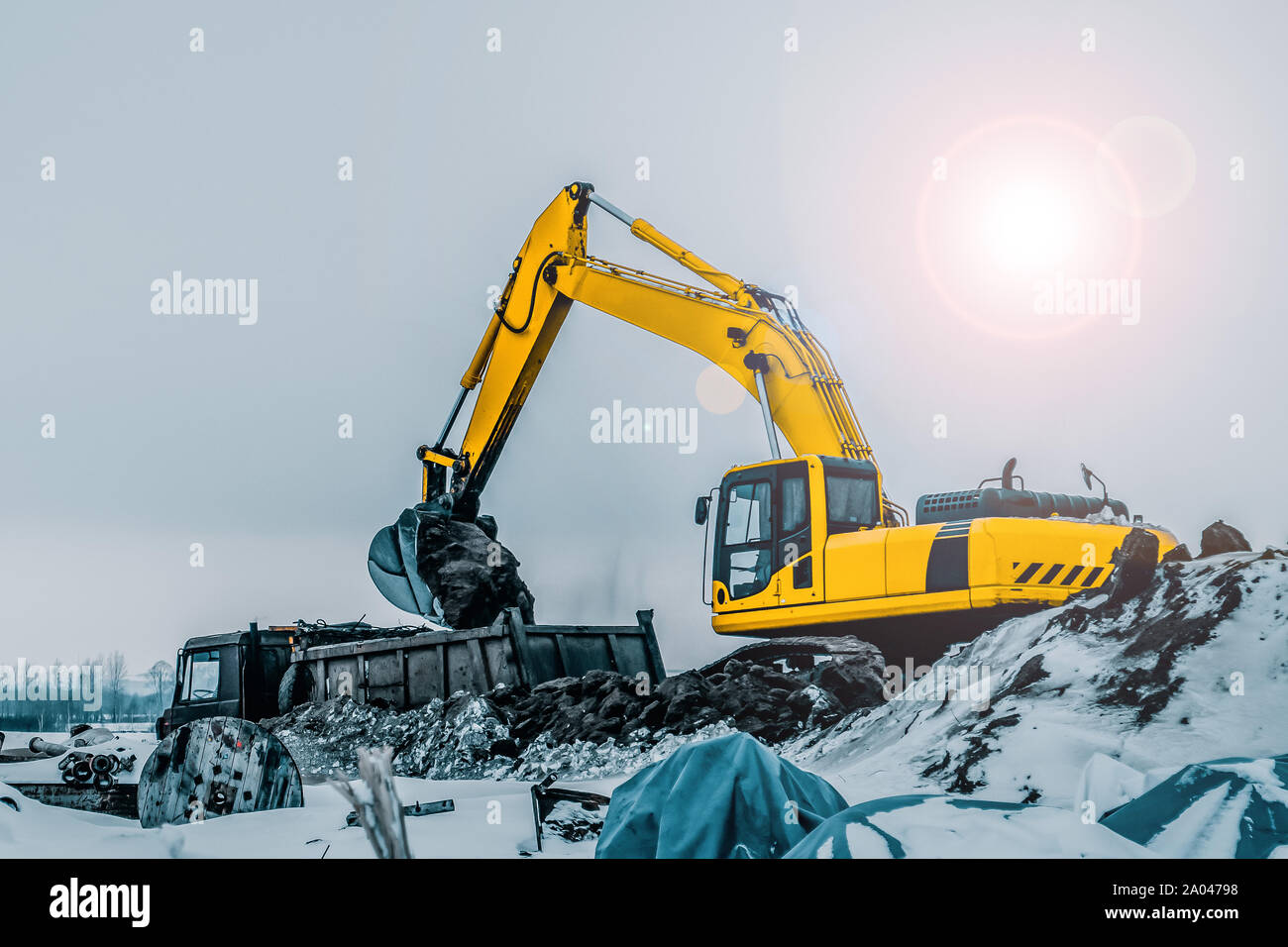Excavator is loading excavation to the truck. Excavators are heavy ...