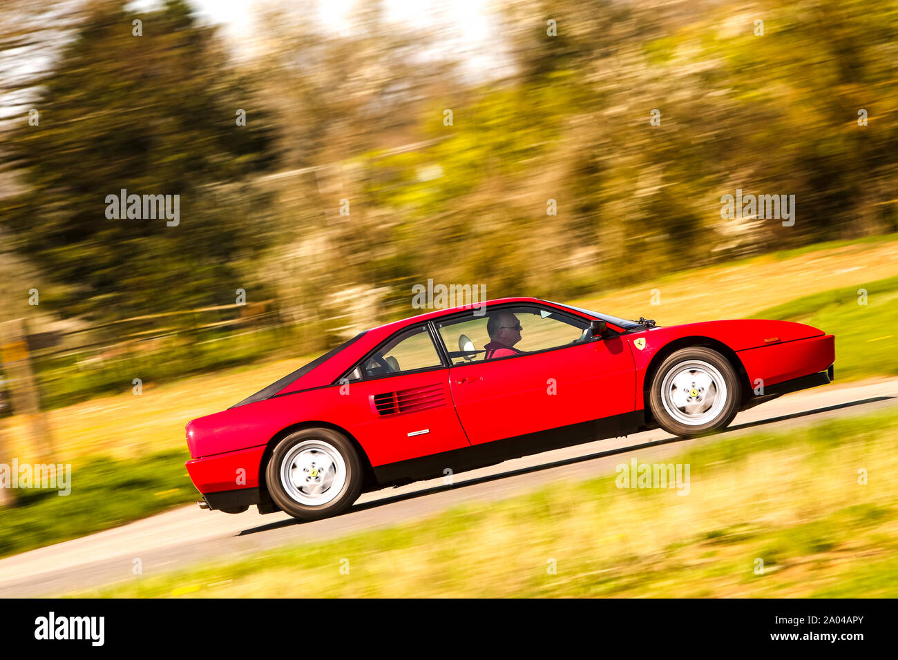 red Ferrari Mondial driving at speed Stock Photo - Alamy