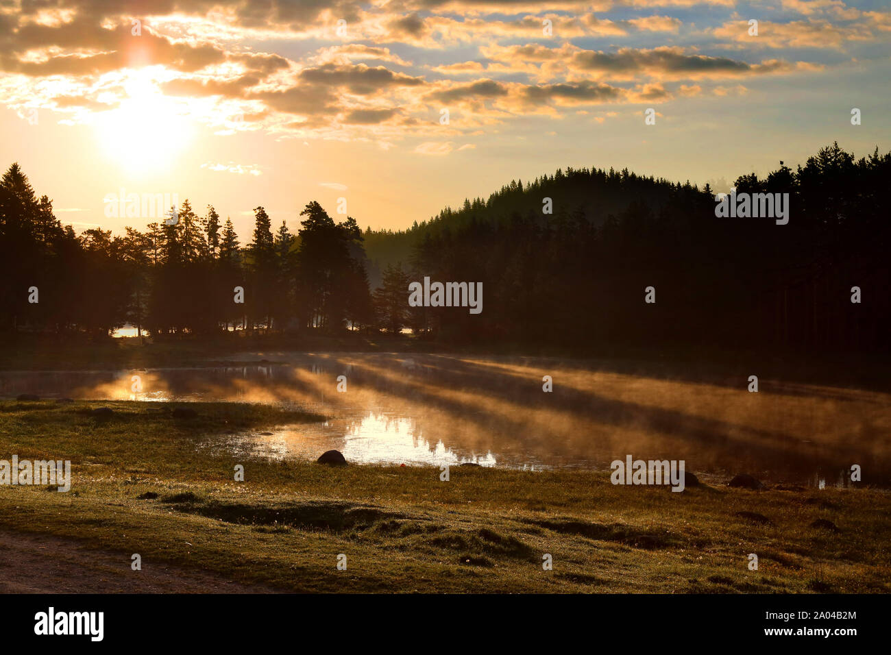 Beautiful sunrise over a lake Stock Photo - Alamy
