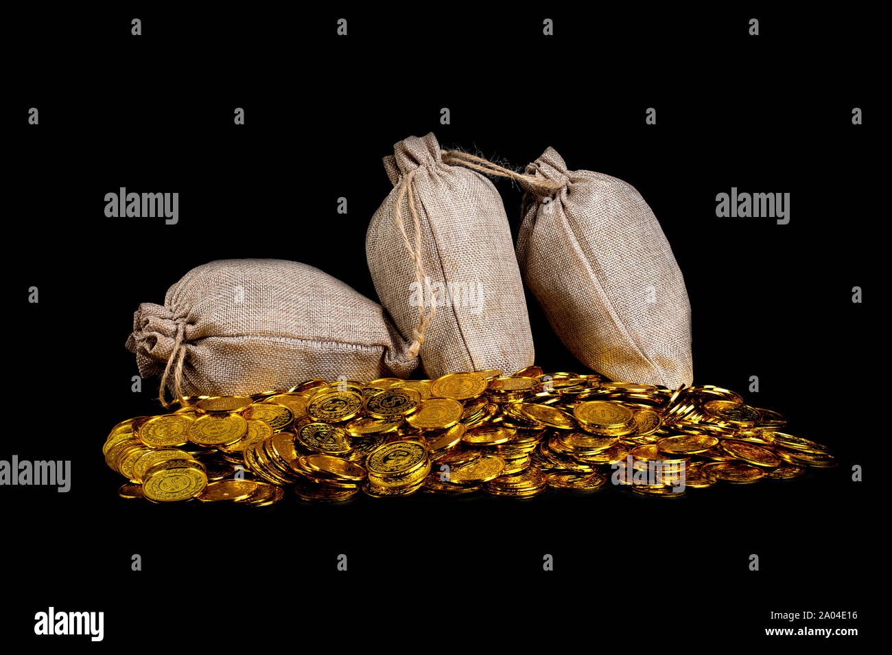Lots of gold coin in treasure sack at black background Stock Photo - Alamy