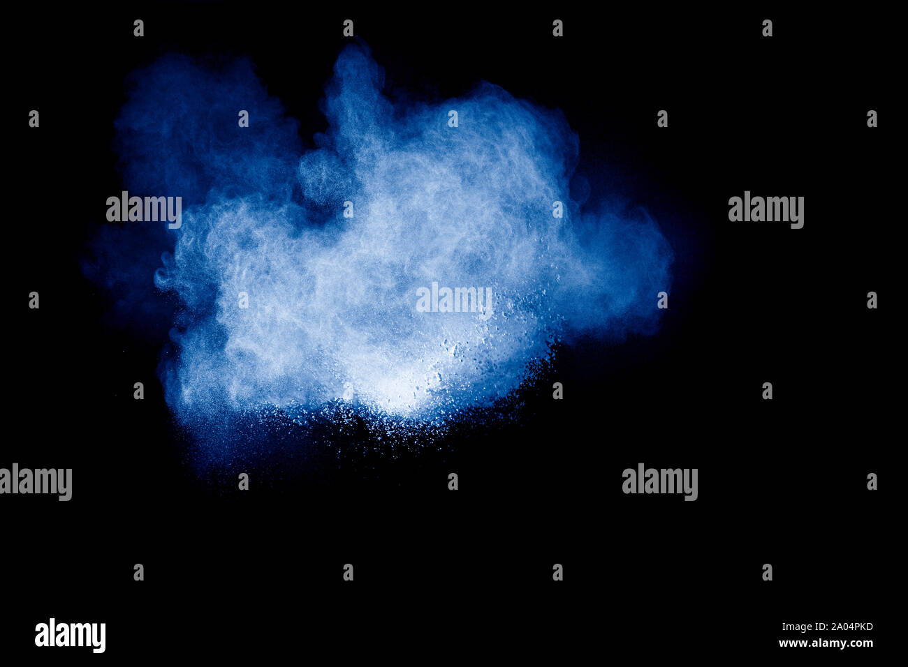 Blue color dust particles splash on black background.Color powder ...