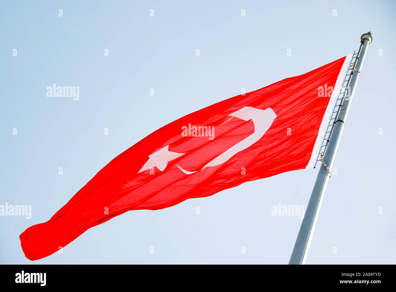 Turkish flag waving under the blue bright sky Stock Photo - Alamy