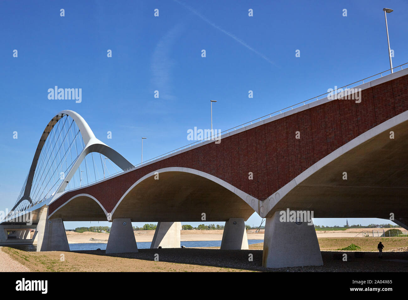 Bowstring arched bridge the 'Oversteek' which spans the river Waal at ...