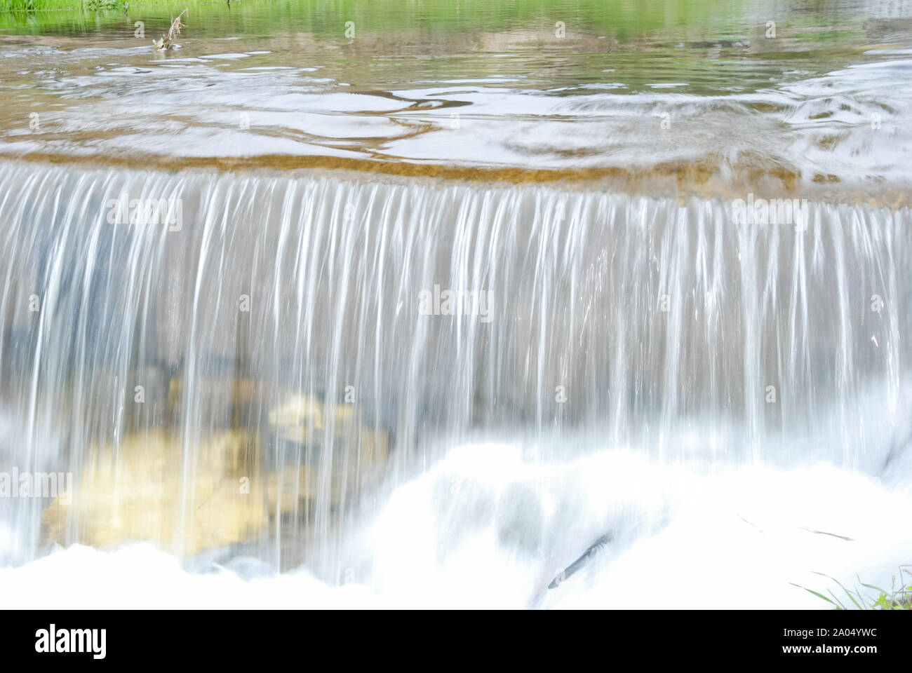 Beautiful nature waterfall on a small lake Stock Photo - Alamy