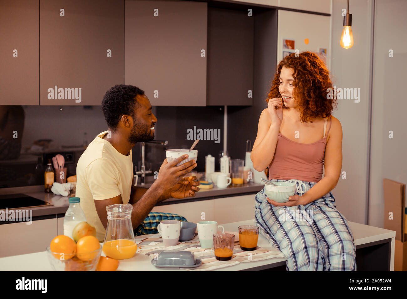 Pleasant talk. Kind male person sitting in semi position and listening ...