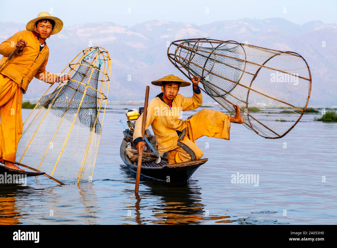 Vacations two men fishing rowing boat hi-res stock photography and ...