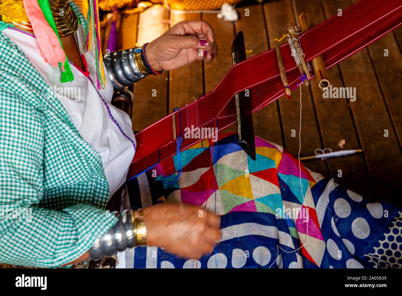 A Senior Woman From The Kayan (Long Neck) Ethnic Group Weaving Fabric ...