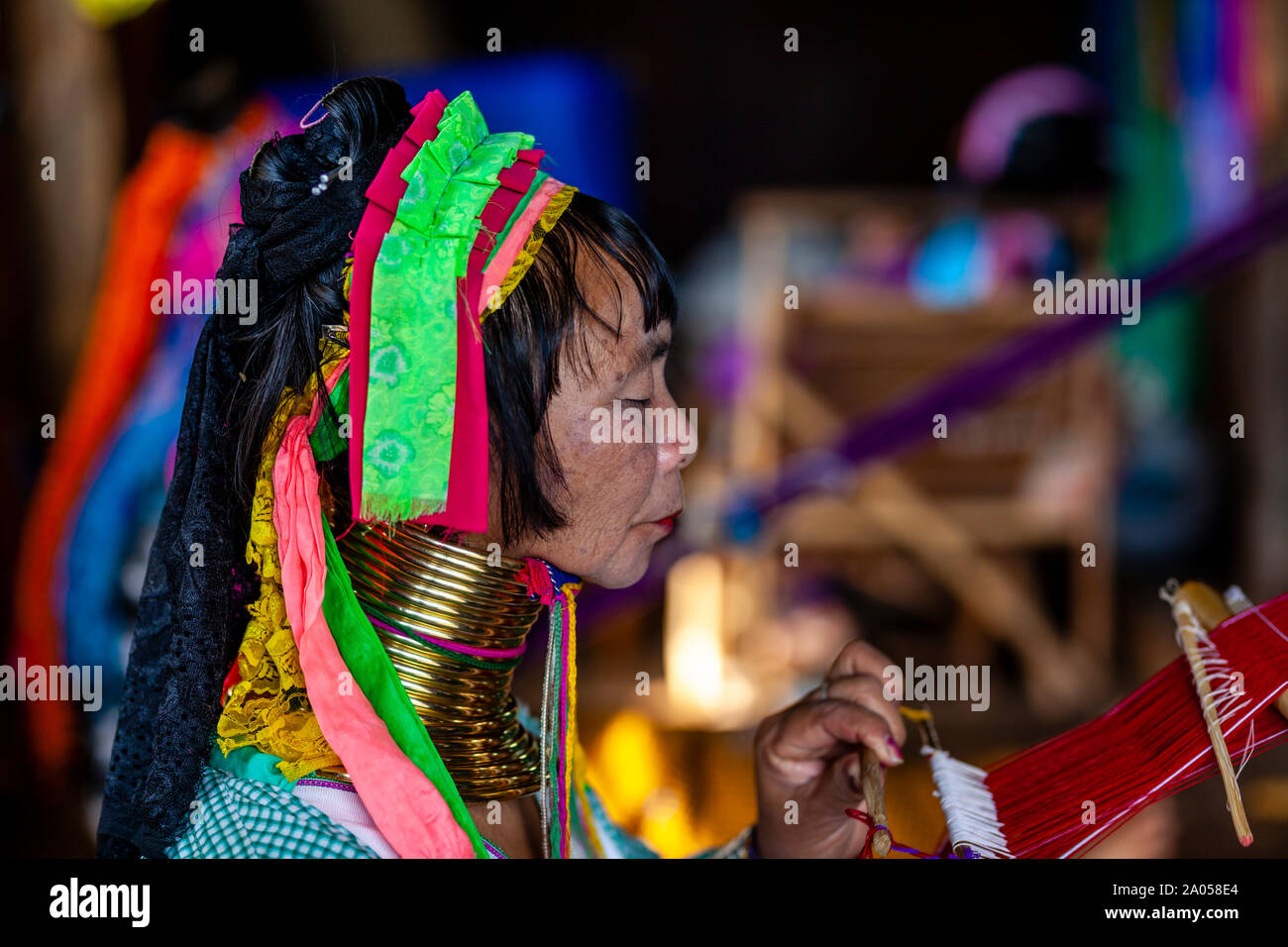 A Senior Woman From The Kayan (Long Neck) Ethnic Group Weaving Fabric ...