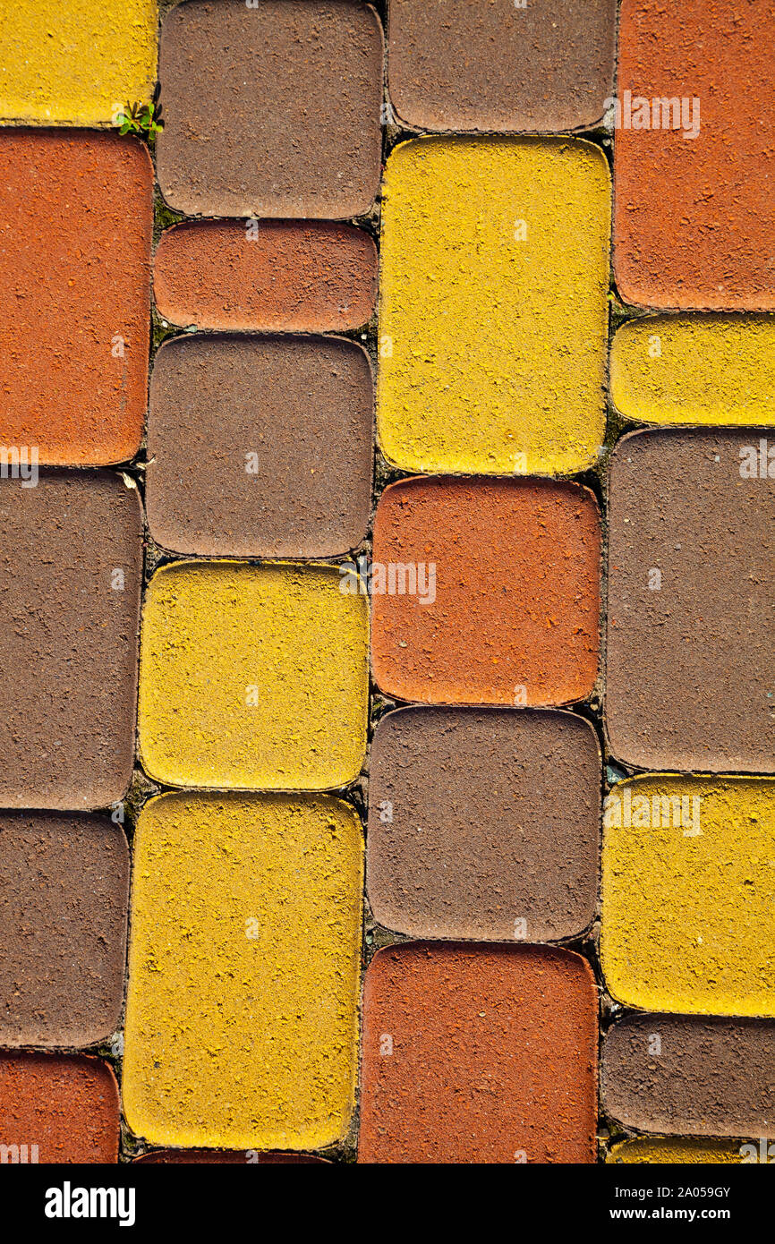 Orange with brown paving slabs close up Stock Photo - Alamy