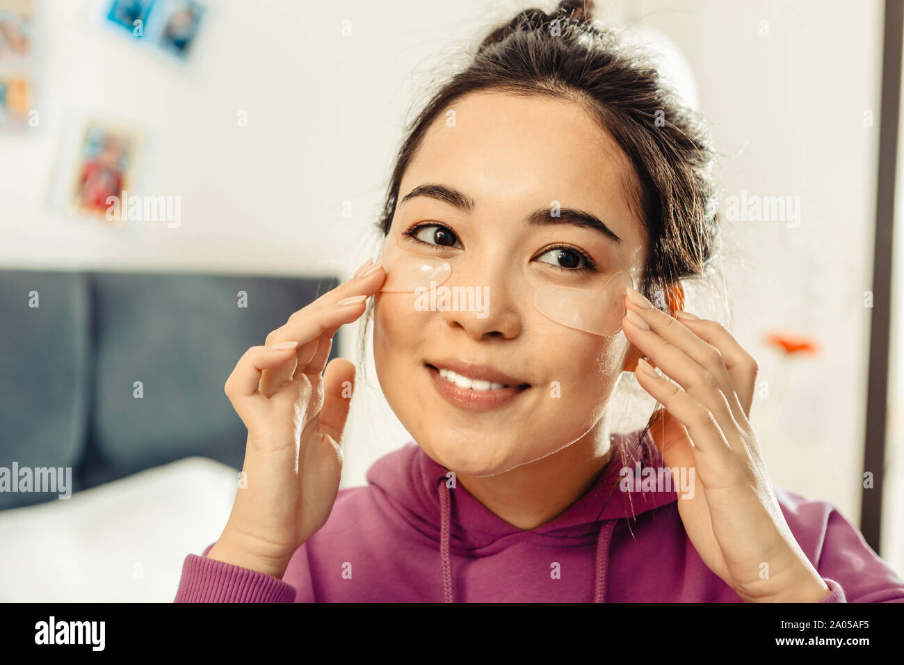 Young asian woman taking off hi-res stock photography and images - Alamy