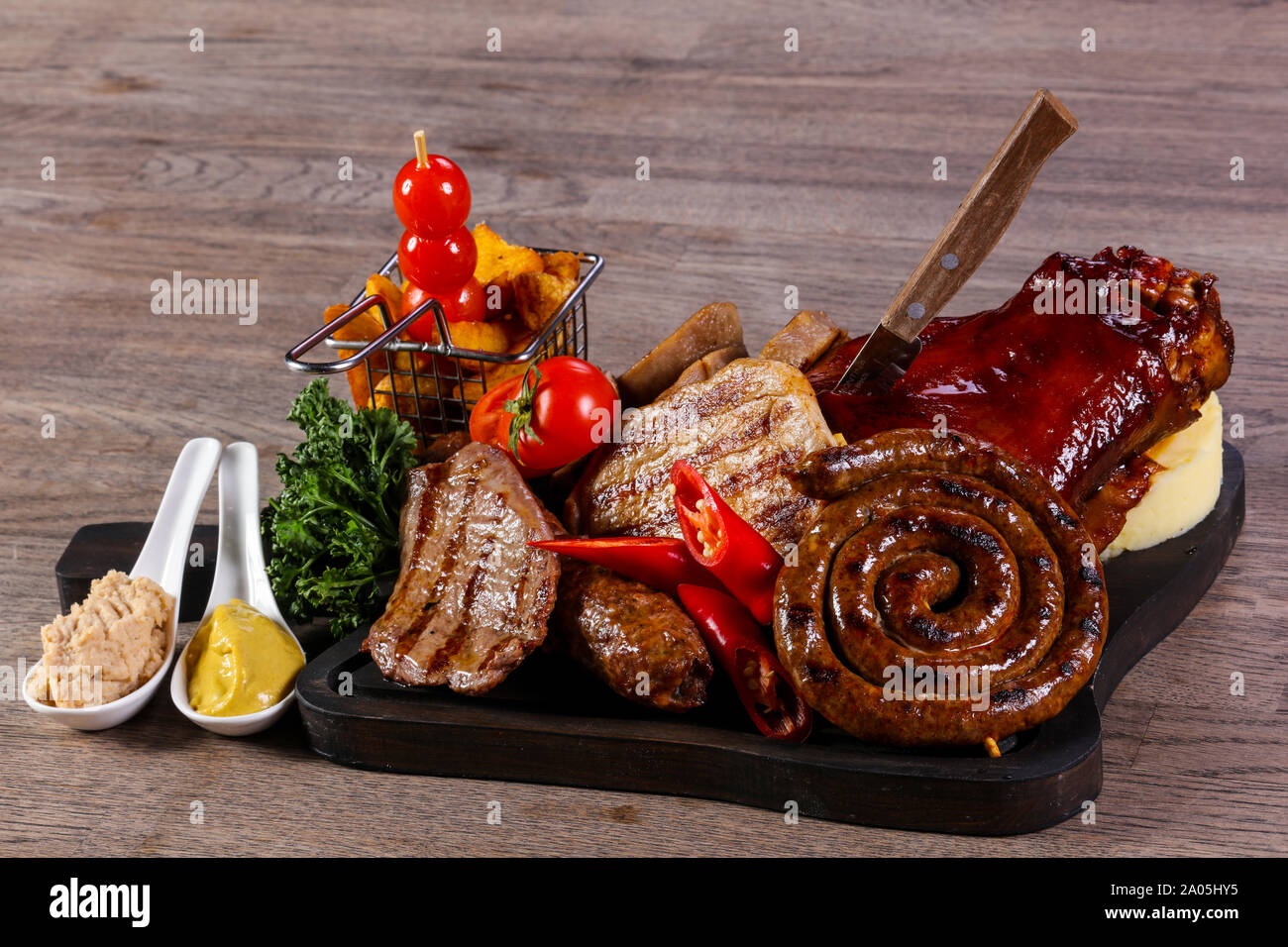 Grilled meat mix plate - beef, pork and chicken Stock Photo - Alamy