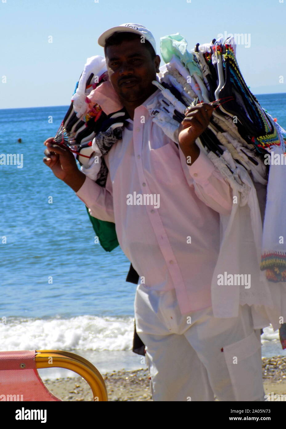 street market, salesman, clothes, sea, beach Stock Photo - Alamy
