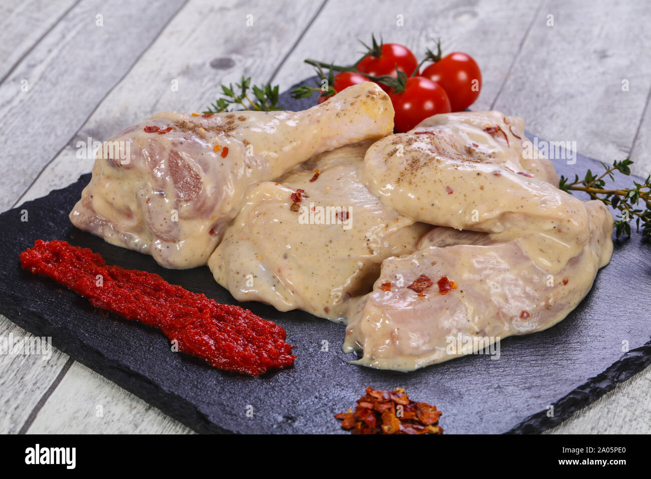 Marinated chicken parts ready for roast Stock Photo - Alamy
