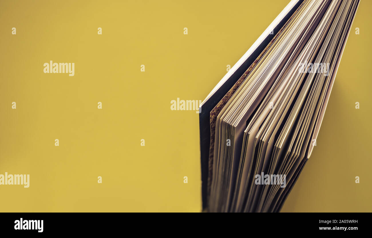Close up beautiful book top view on a yellow background table Stock ...