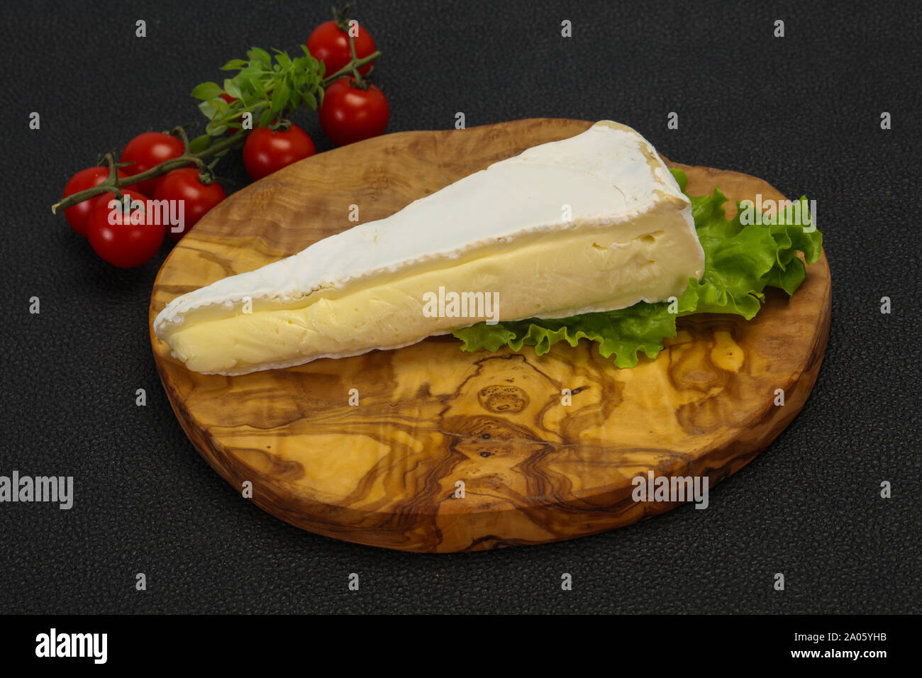 Brie cheese triangle served salad leaves Stock Photo - Alamy