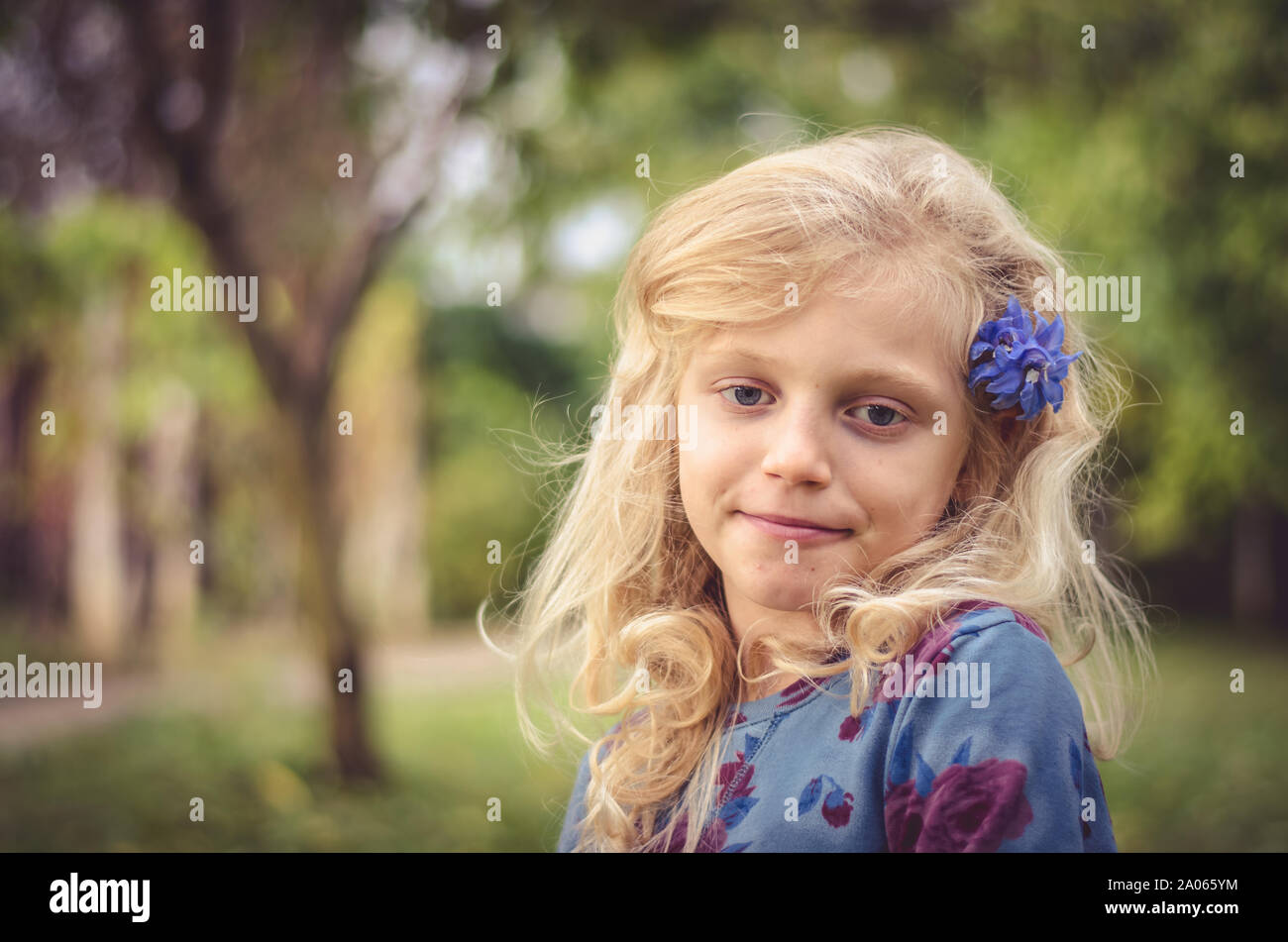 beautiful child with long blond hair portrait Stock Photo - Alamy