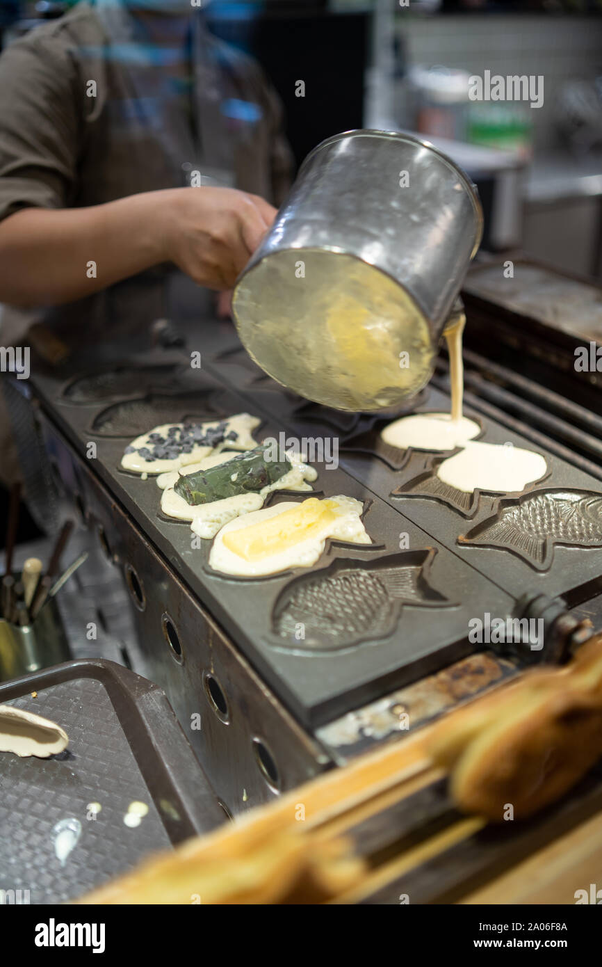 Kaohsiung, Taiwan: Traditional taiwanese / japanese waffles. Female ...