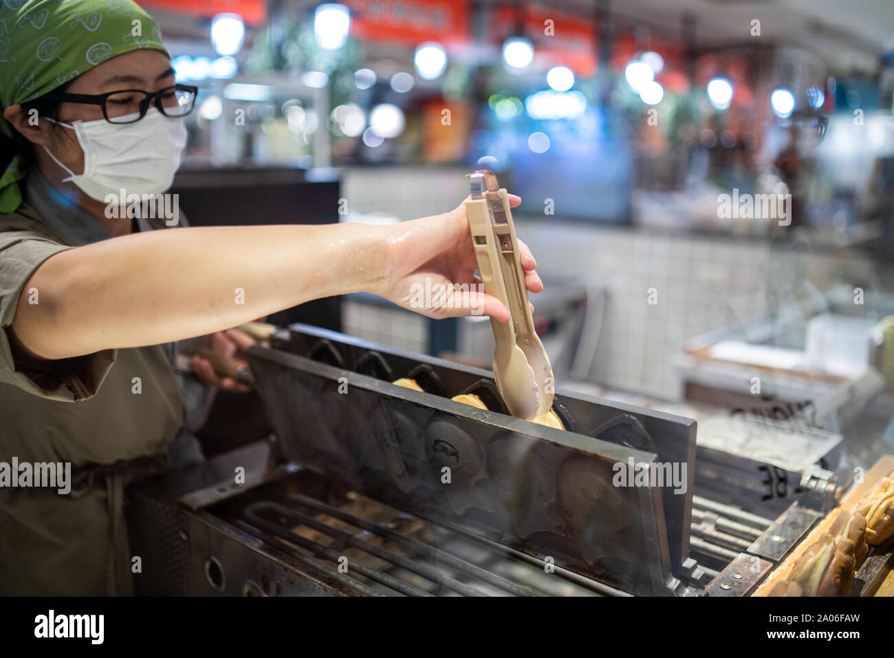 Kaohsiung, Taiwan: Traditional taiwanese / japanese waffles. Female ...