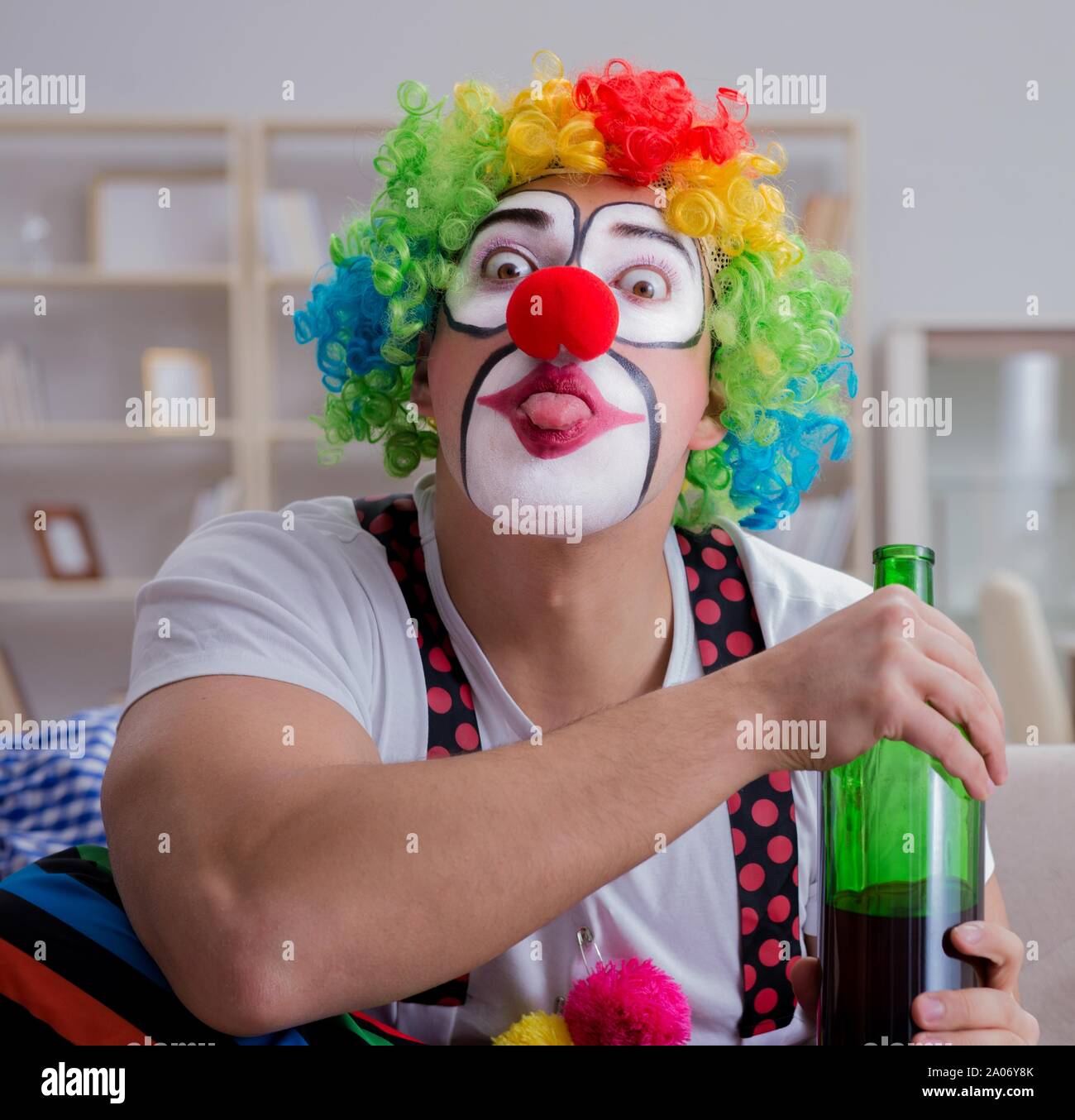 The drunk clown celebrating having a party at home Stock Photo - Alamy